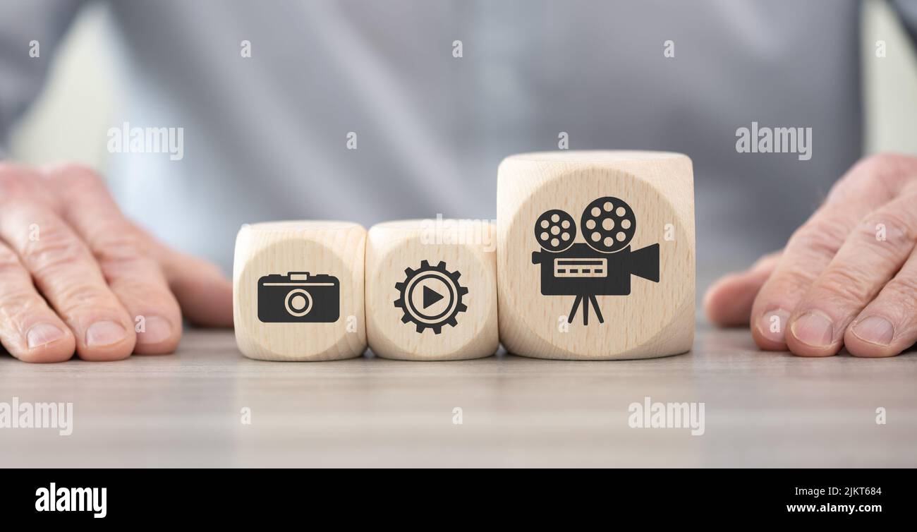 Wooden blocks with symbol of cinema concept Stock Photo - Alamy