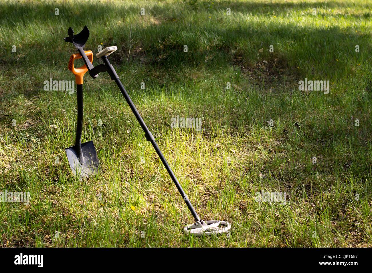 The wireless metal detector rests on a shortened metal blade on the ...