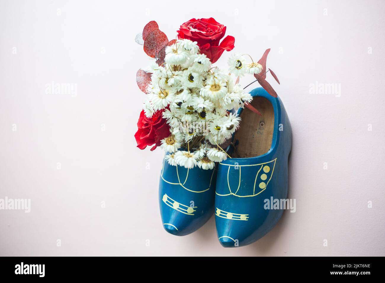 Dutch clogs design. Clogs are a type of footwear made in part or ...