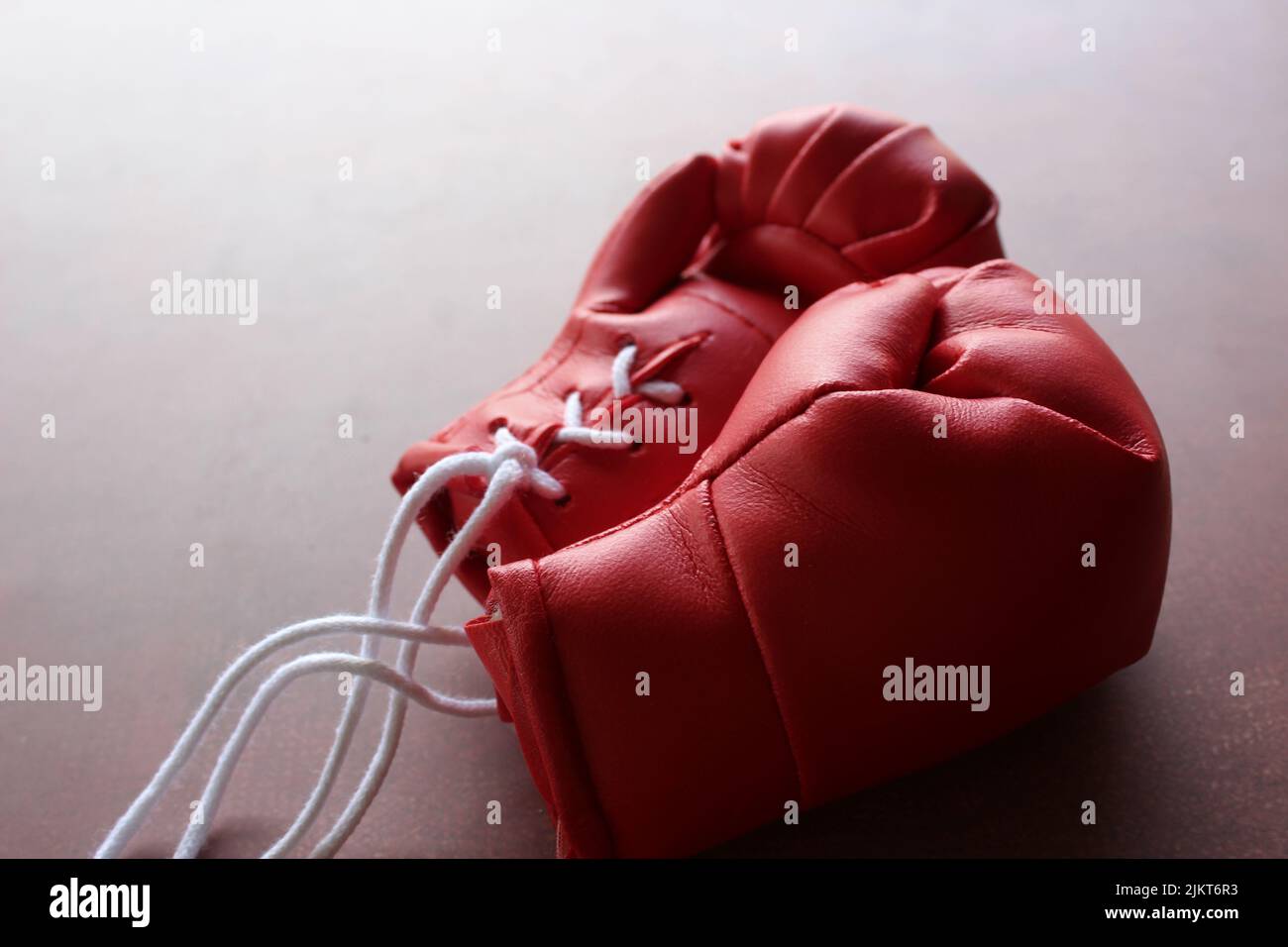 Close up image of red boxing gloves on table. Sports concept Stock ...