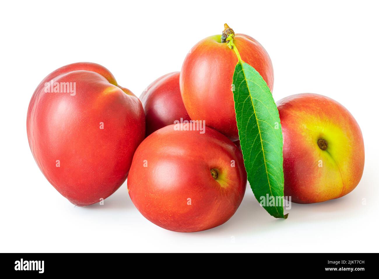Group of nectarines with leaves isolated by clipping paths on a white ...