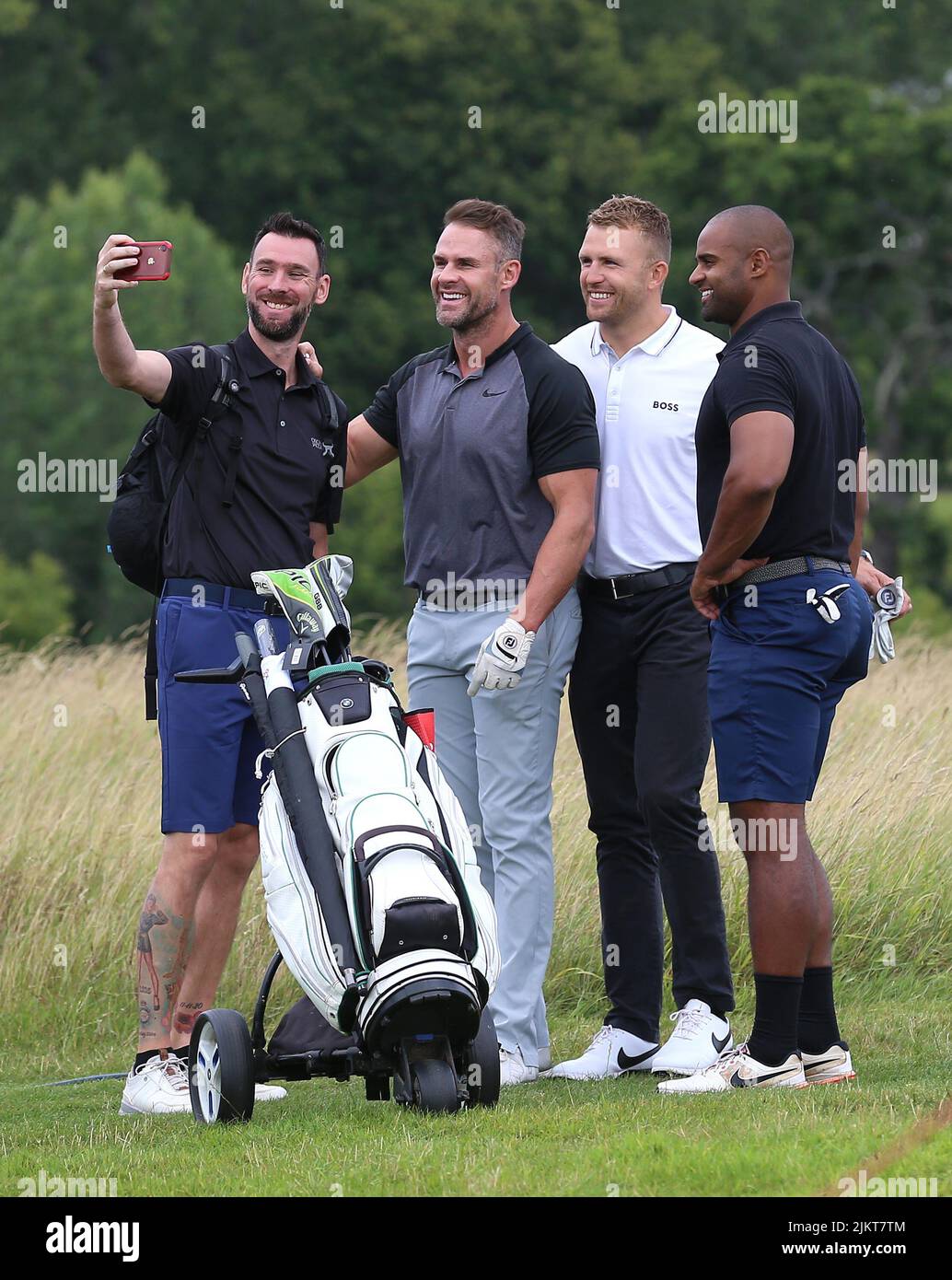 A spectator poses for a picture with Welsh rugby players Aled Brew ...