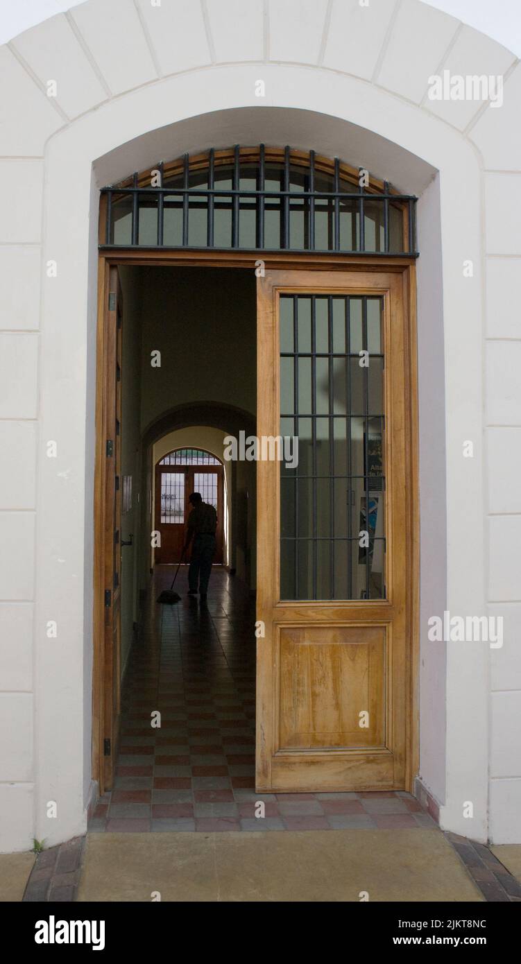 The entrance of a building with an open wooden door Stock Photo - Alamy