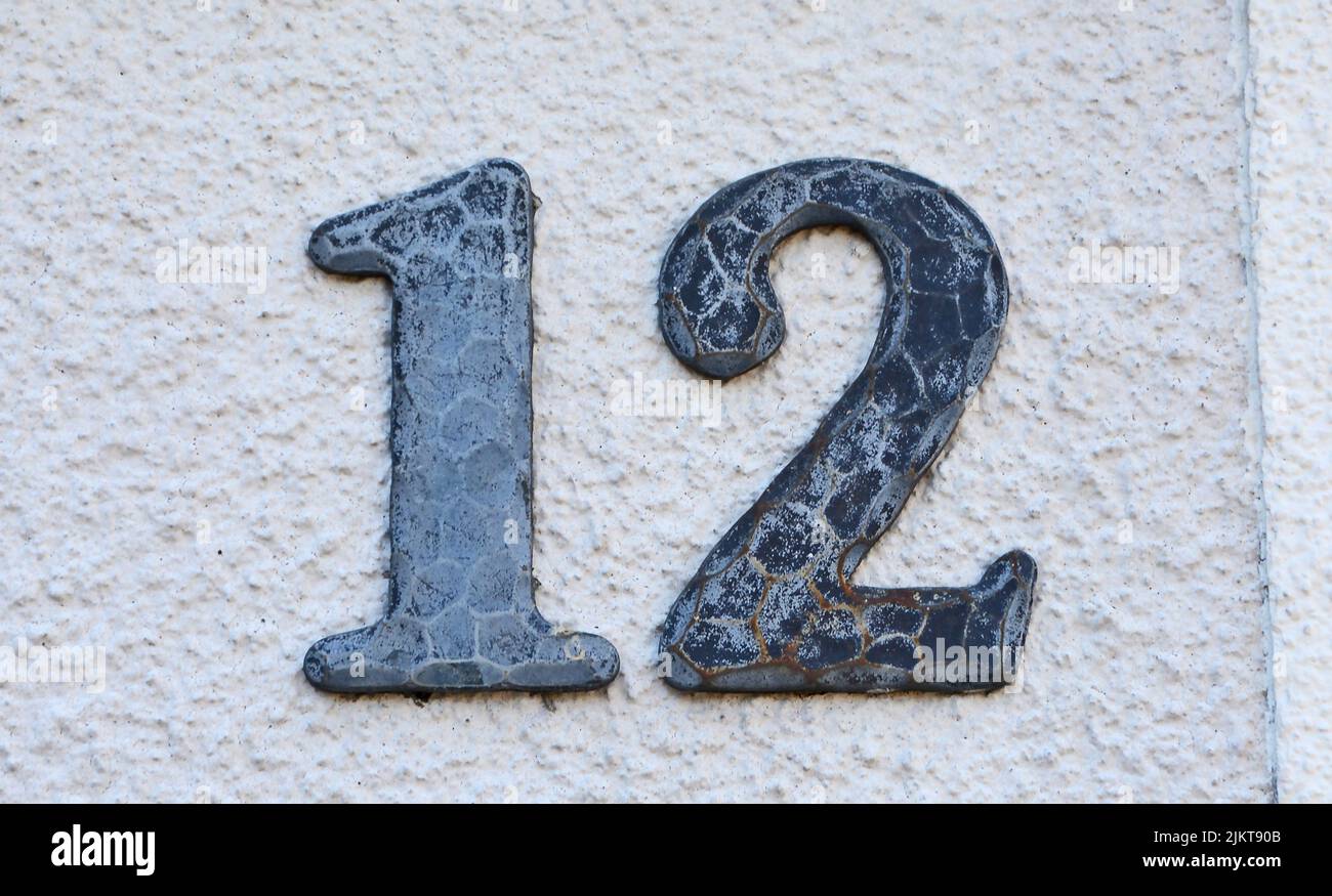 The number 12 carved on a white wall Stock Photo - Alamy