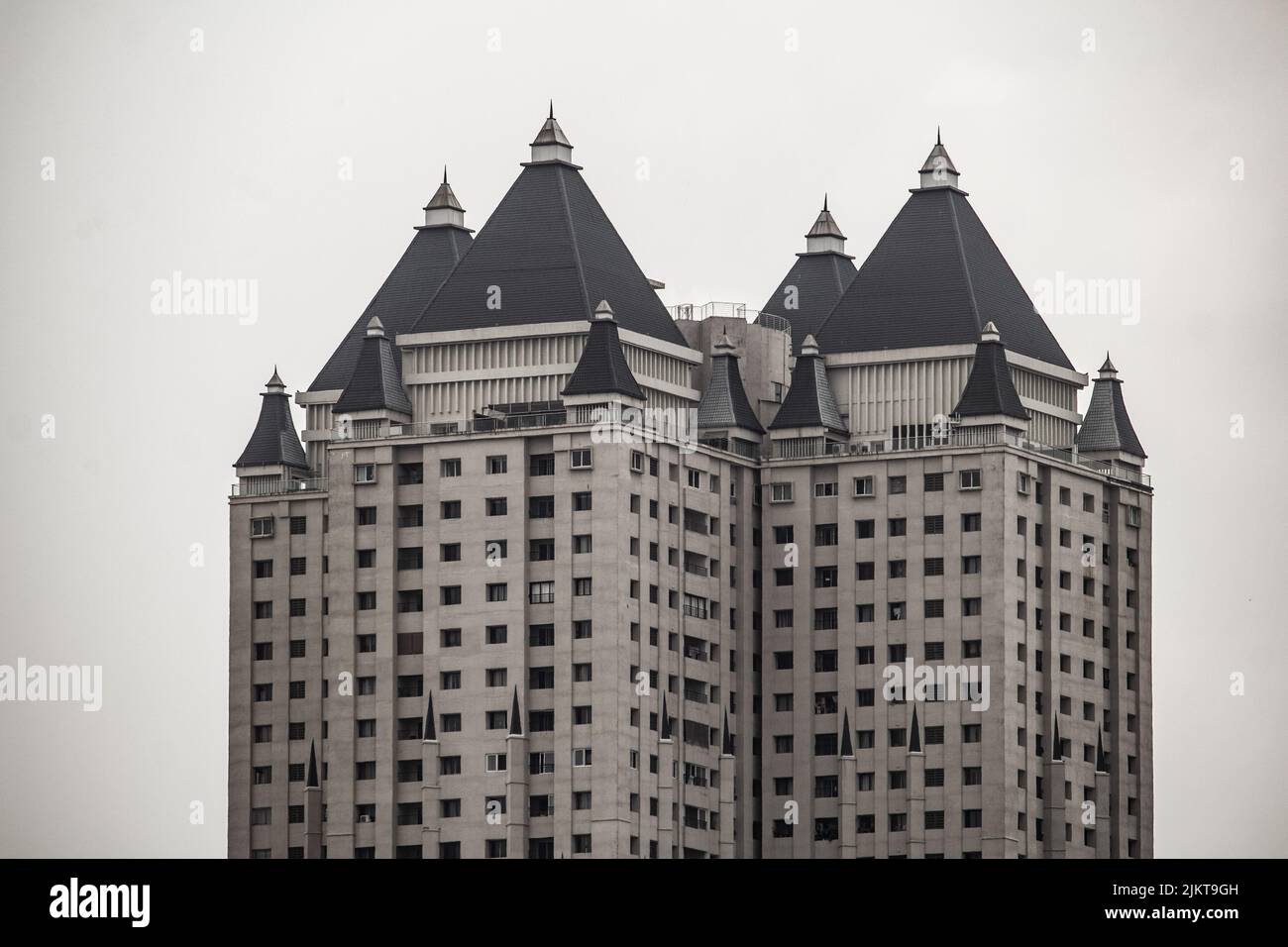 A grayscale shot of an old building against a white sky Stock Photo - Alamy