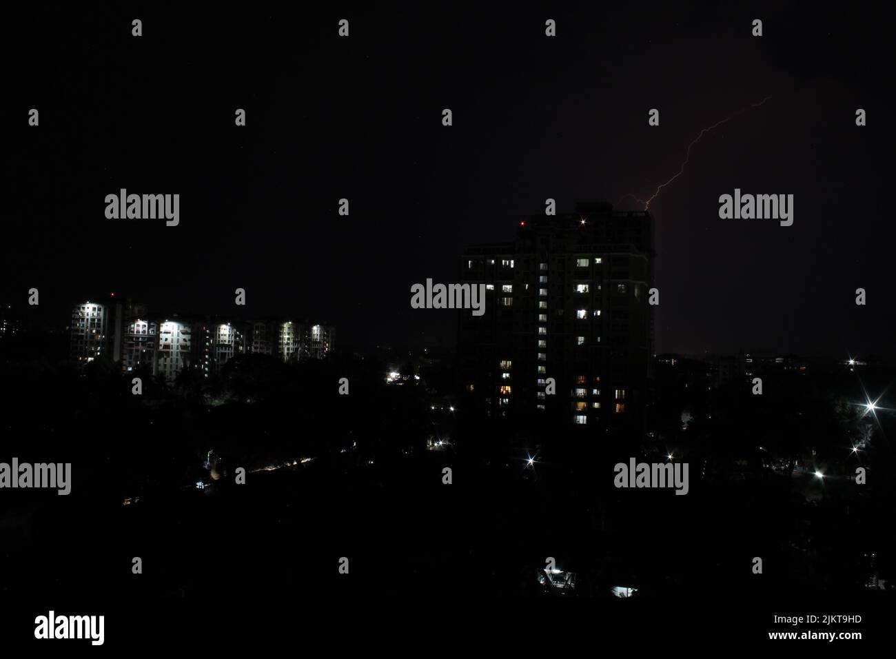 An evening view of building lights in a city Stock Photo - Alamy