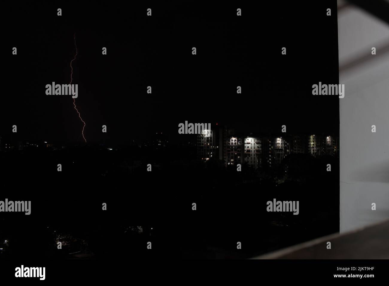 An evening view of building lights in a city Stock Photo - Alamy