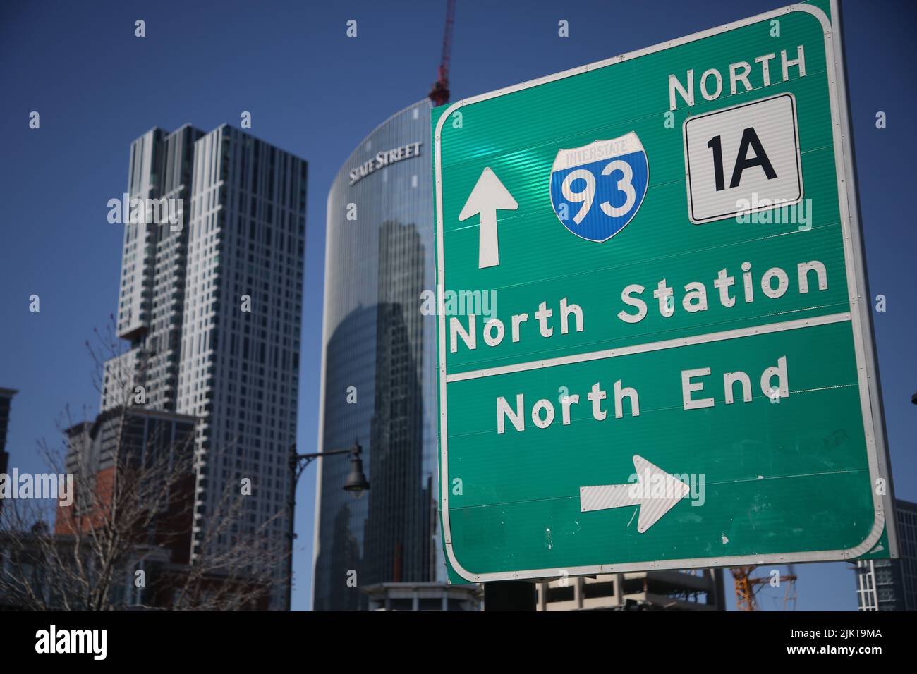 A directional sign in Boston showing the way to various highways such ...