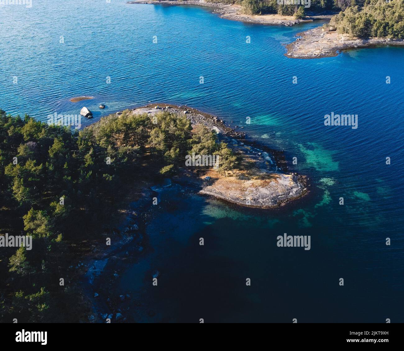 An aerial view of a beautiful island surrounded by the blue sea Stock ...