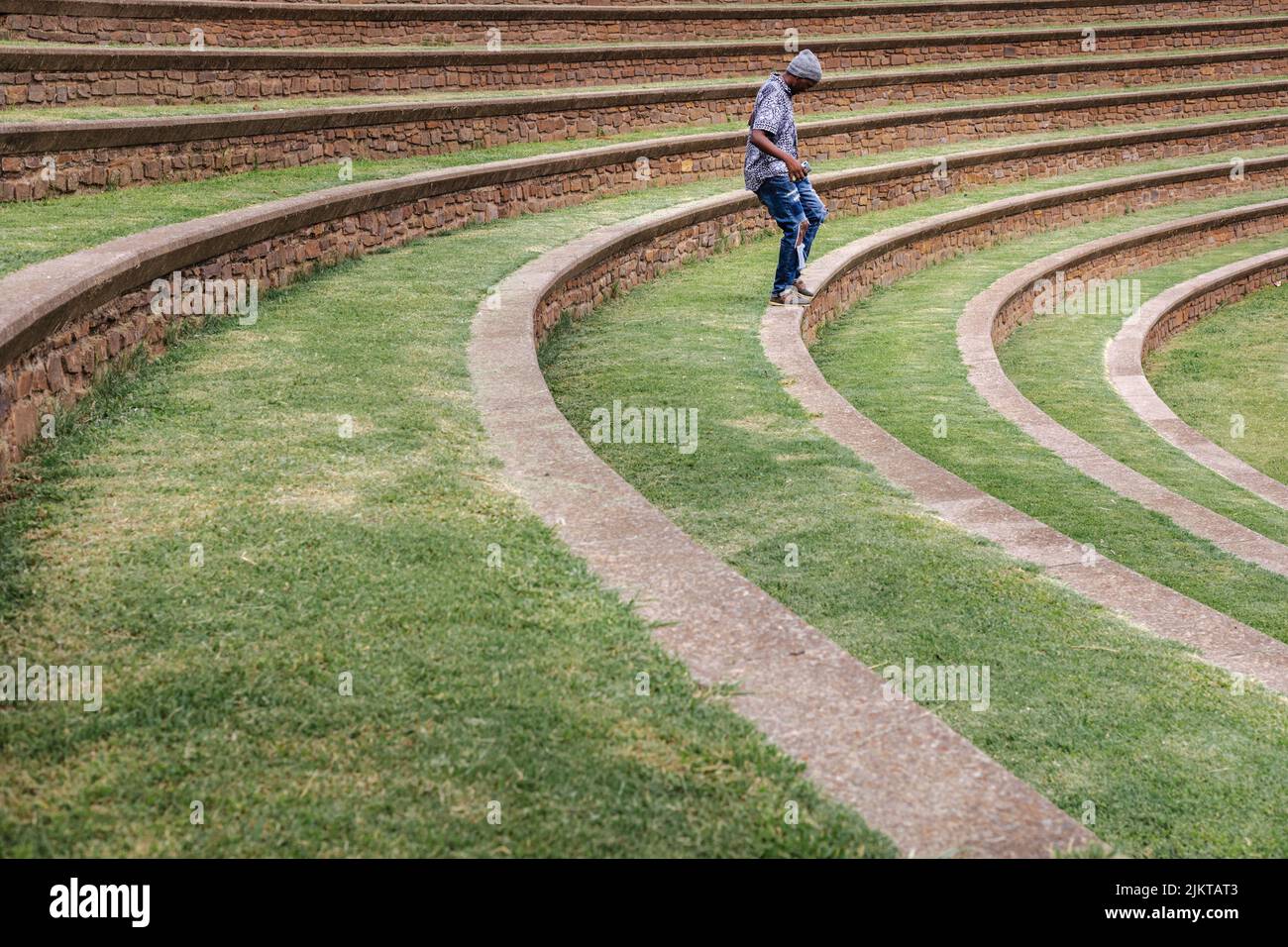 An African man walking down the steps of the amphitheatre at the Union ...