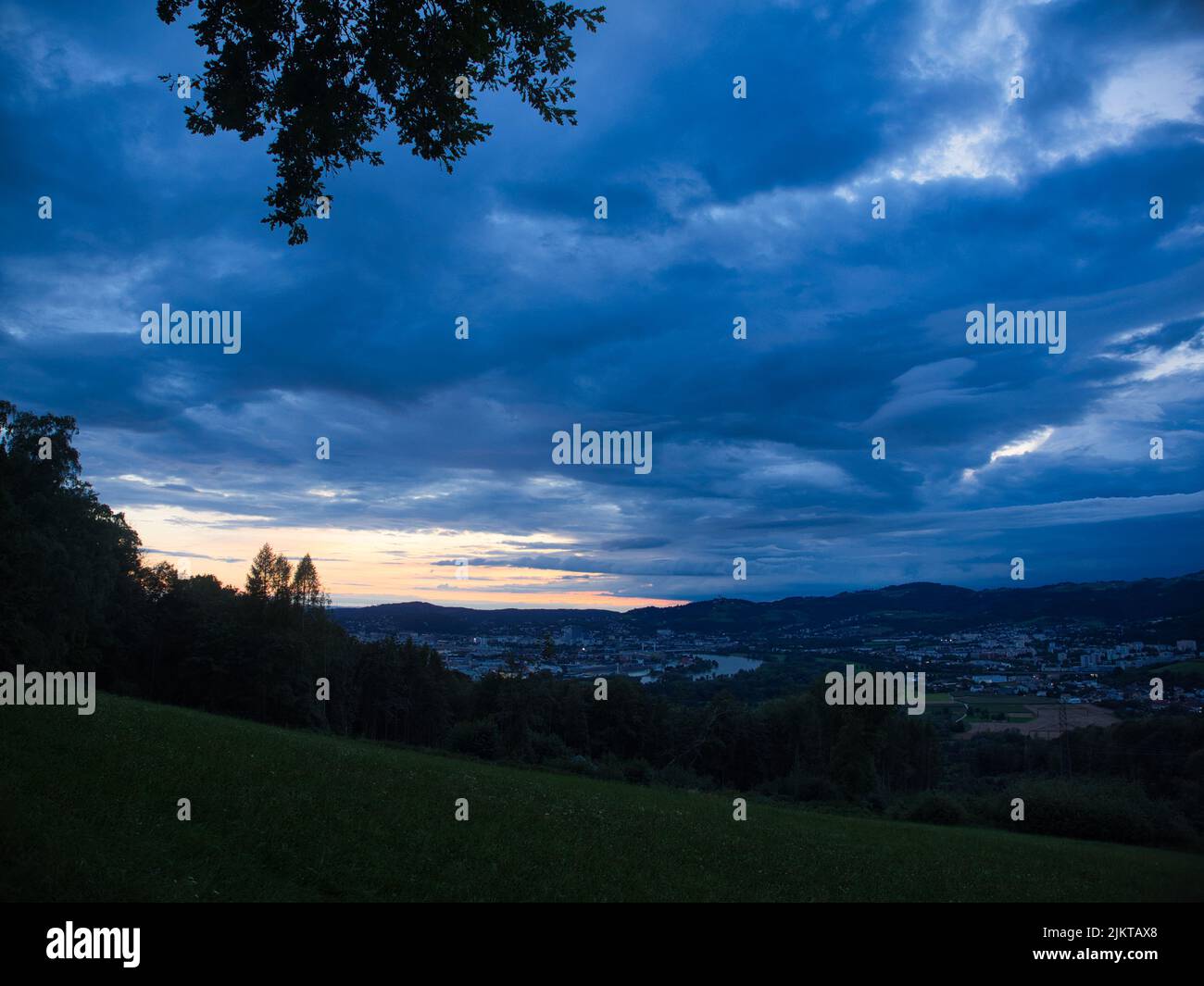 Landscape photo of the city of Linz by the Danube from a distance with ...