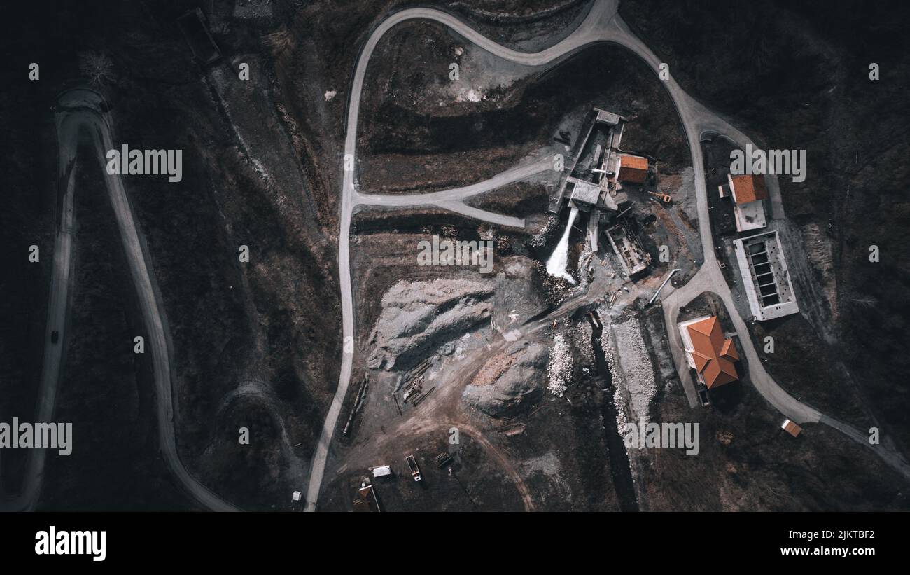 An aerial view of land with highway roads and rural houses with empty ...