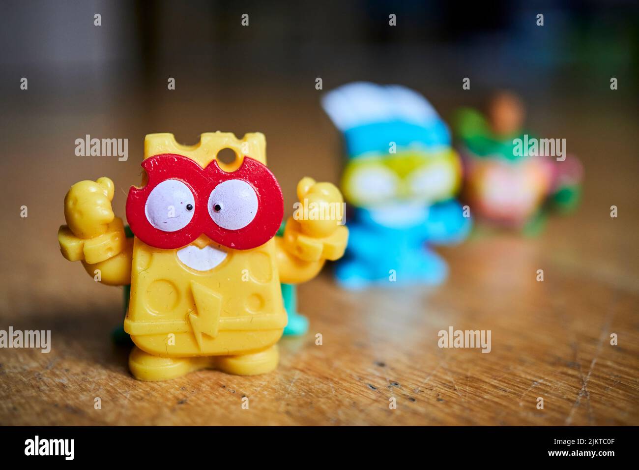 A closeup of Super Things Kazoom Kids series cheese shaped toy figurine ...
