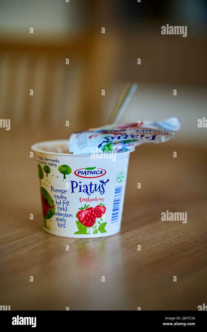 A vertical closeup of an opened Polish Platnica brand Piatus yogurt for ...
