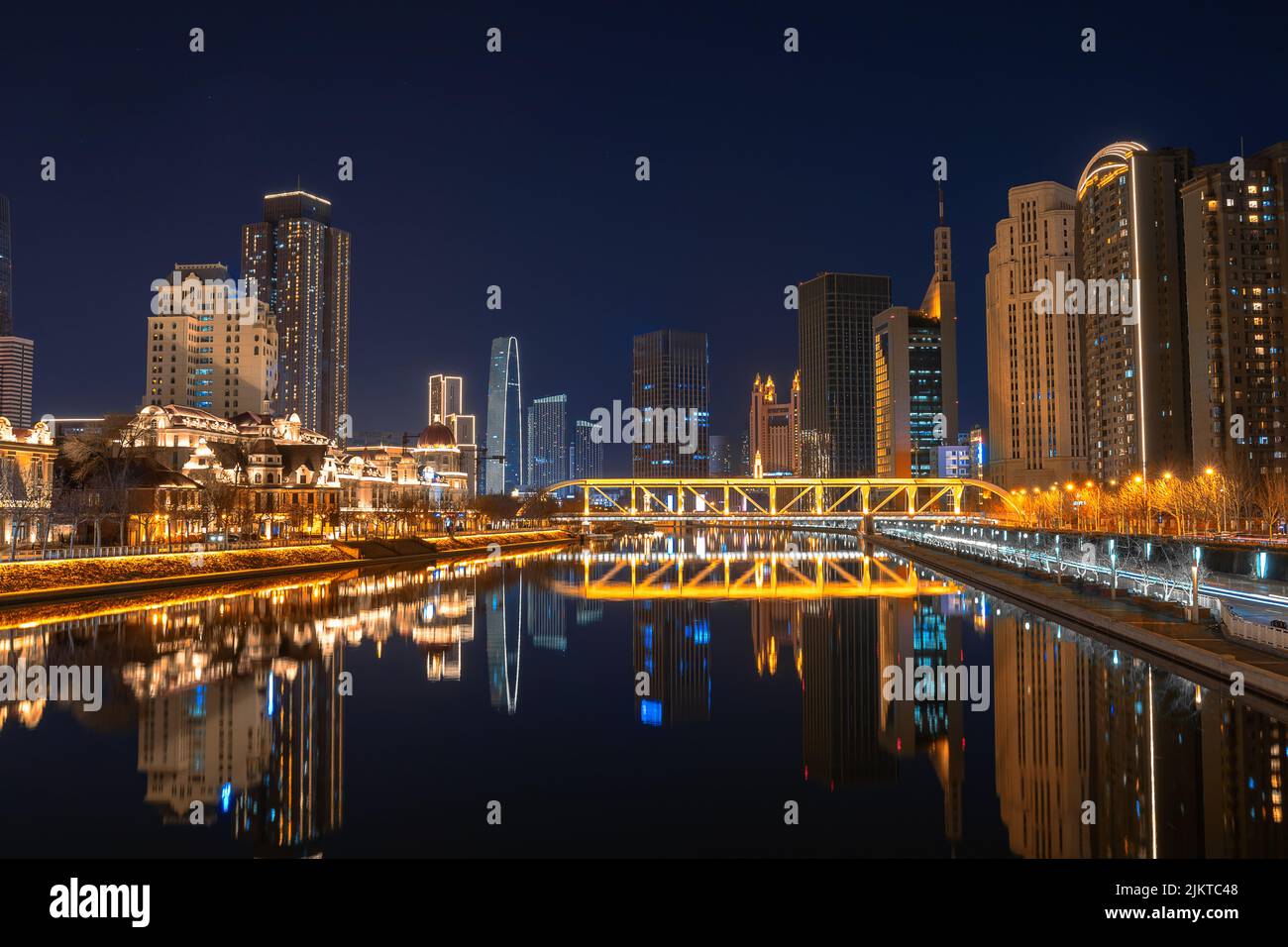 City scape with modern buildings and towers with a river in a city by ...