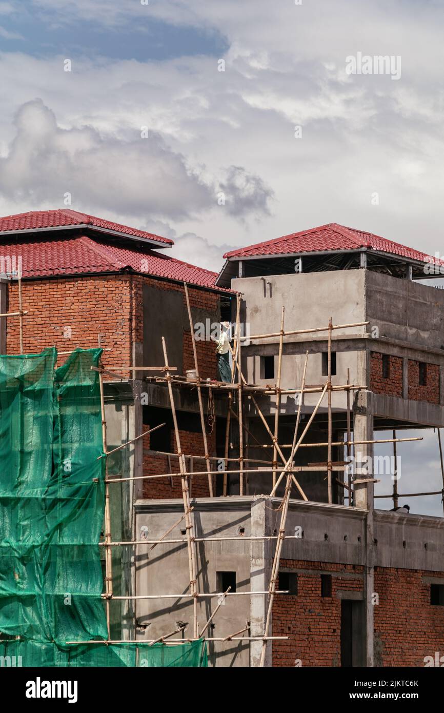 A vertical shot of a construction building in a process Stock Photo - Alamy
