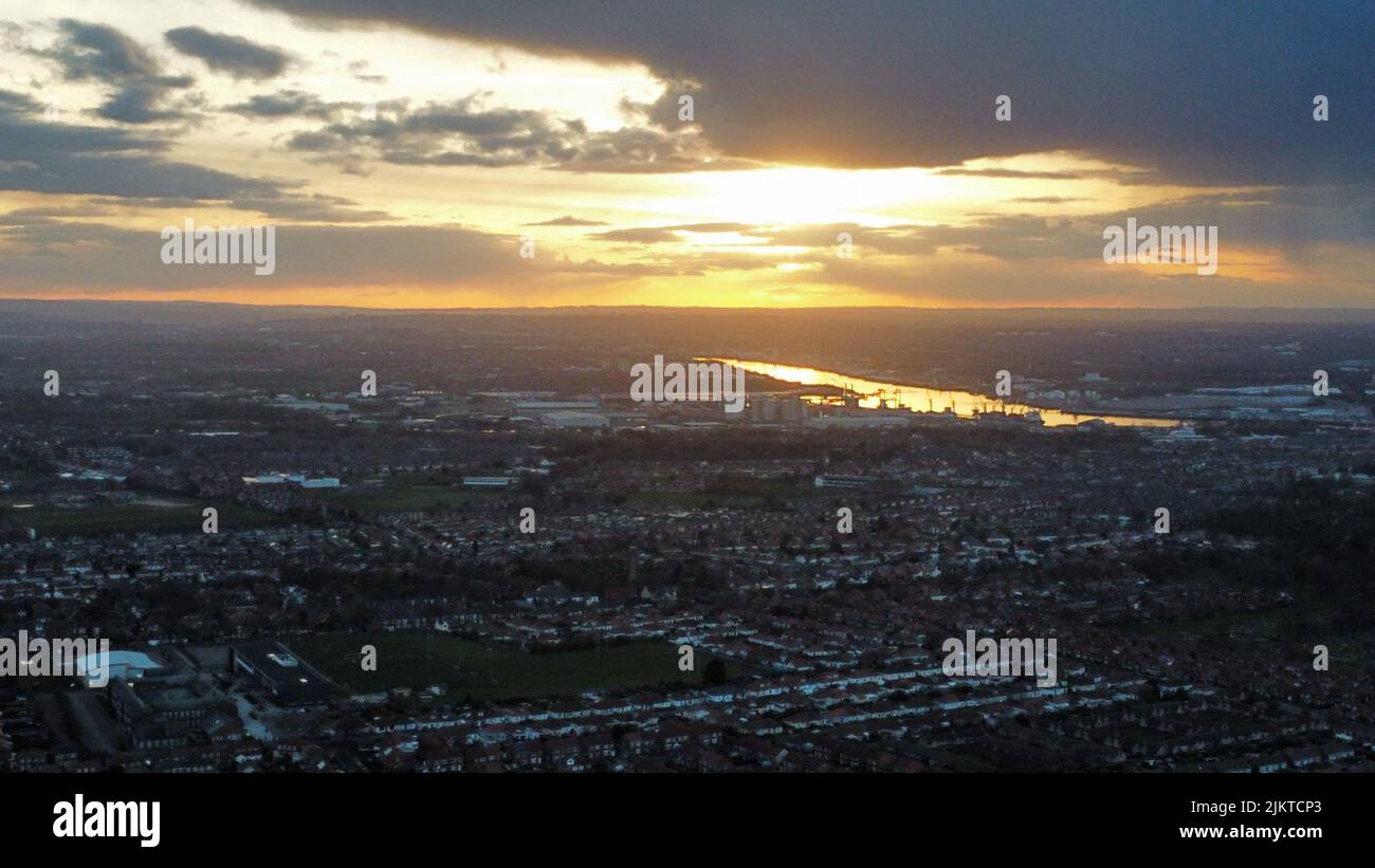 An aerial view of a rural neighborhood with similar houses at sunset ...