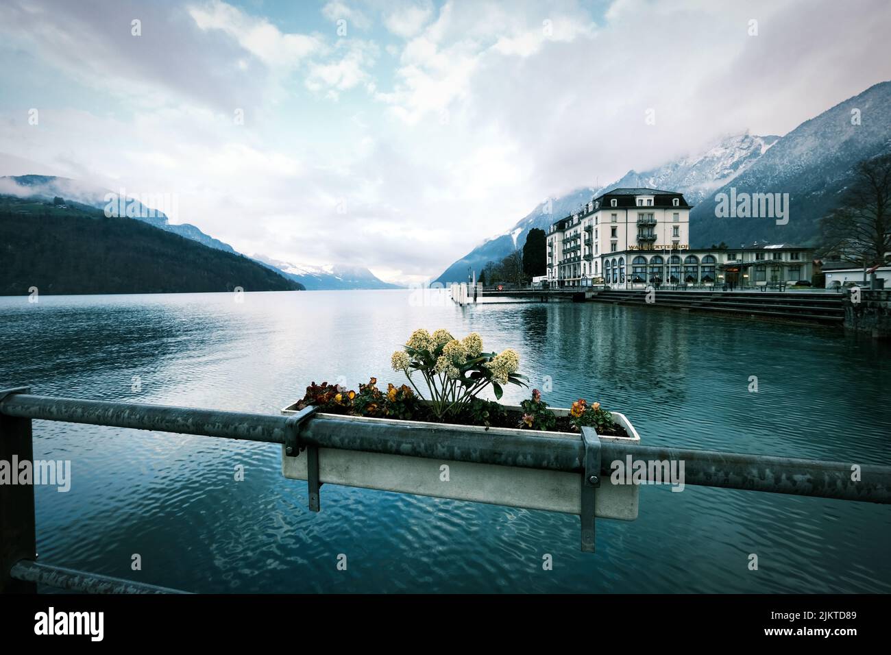 A scenic view of a sunrise over Lake Lucerne on a hotel background ...