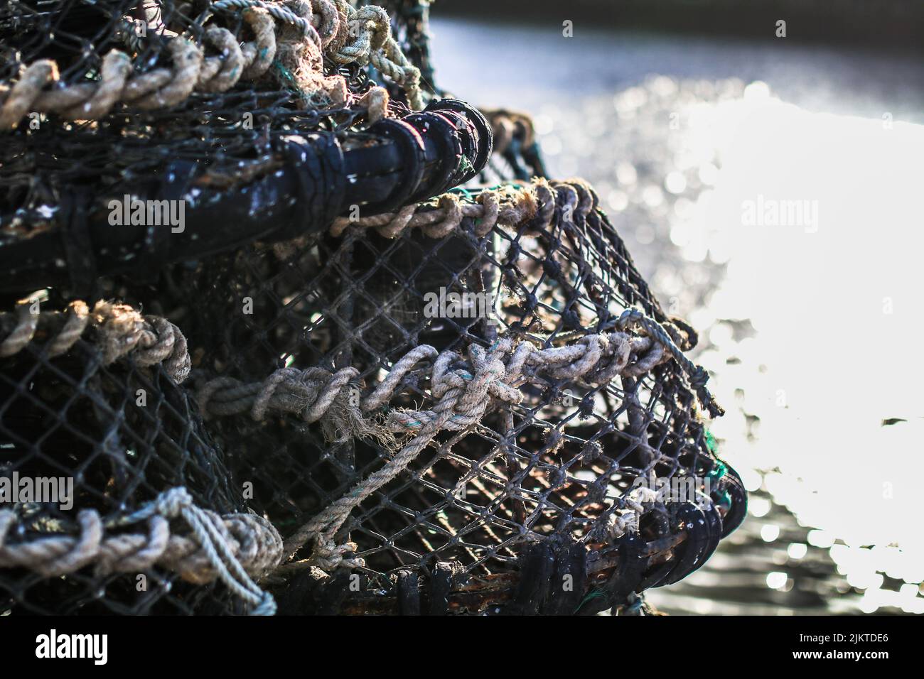 The close-up shot of an old fishing net on a beach Stock Photo - Alamy