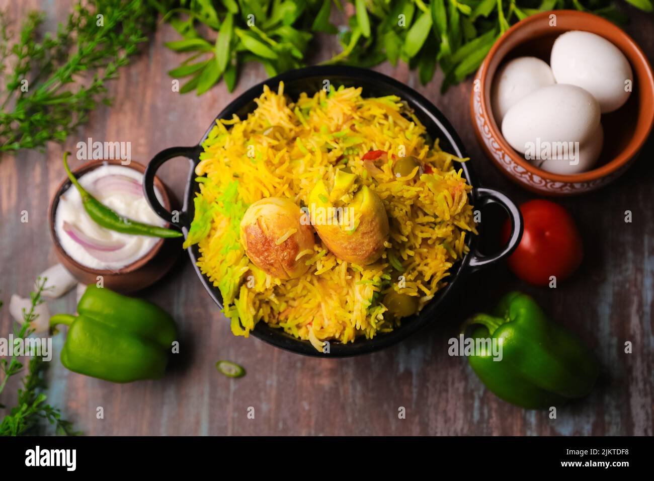 A top view of Indian traditional dish Biryani with chicken meat on a ...
