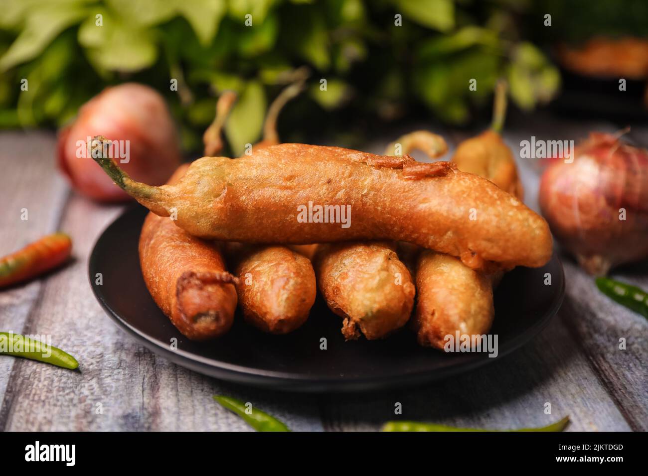 A closeup of the Indian traditional spicy dish Mirchi Bada with minced ...