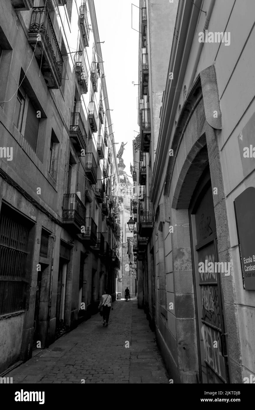 The low angle monochrome shot of a alley with city building view Stock ...