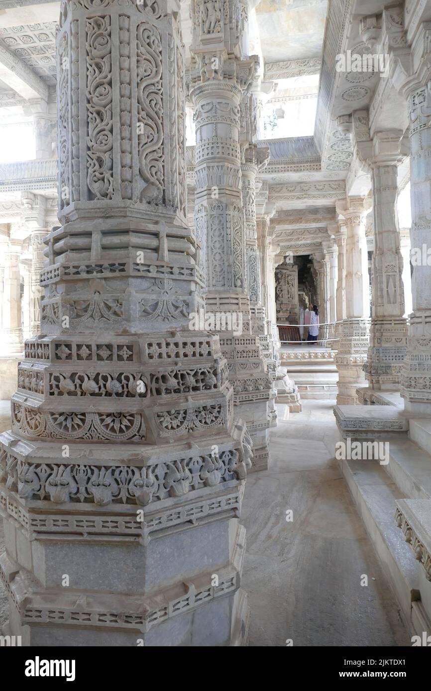 A vertical shot of the columns in the famous Ranakpur Jain Temple in ...