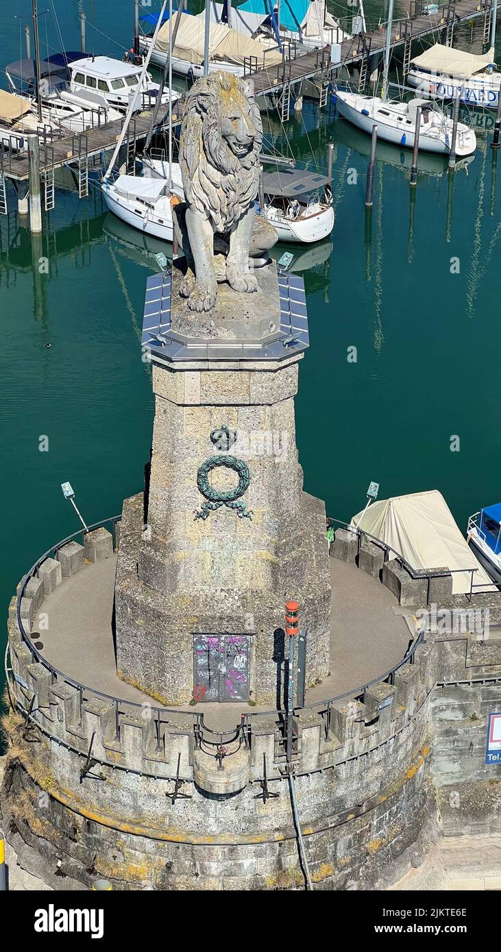 A vertical shot of the famous Bavarian Lion statue in the Lindau ...