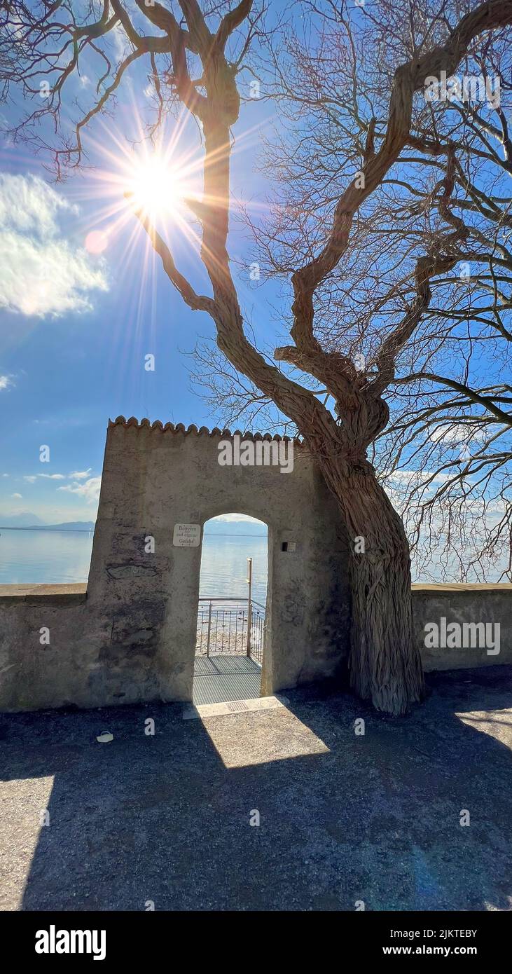 A beautiful view of Lake Constance through a stone passage with an old ...