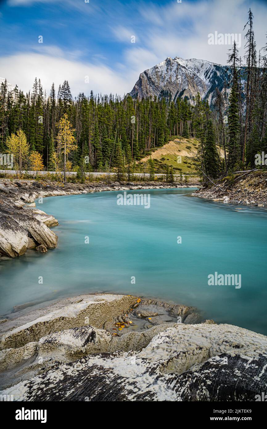 A vertical shot of the landscape with a river and mountain peak ...