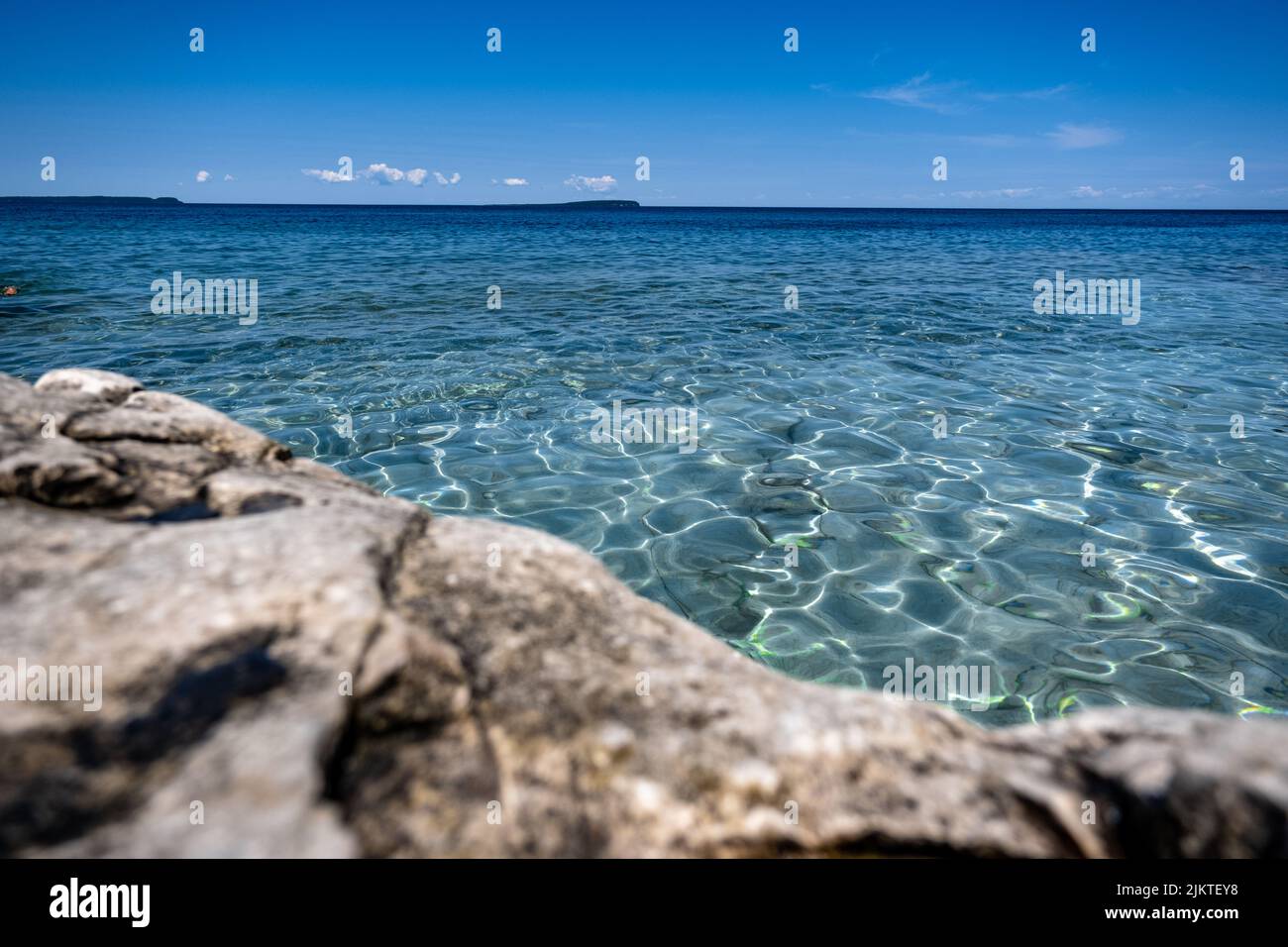 A closeup of the sunlight reflections shining on the surface of a ...