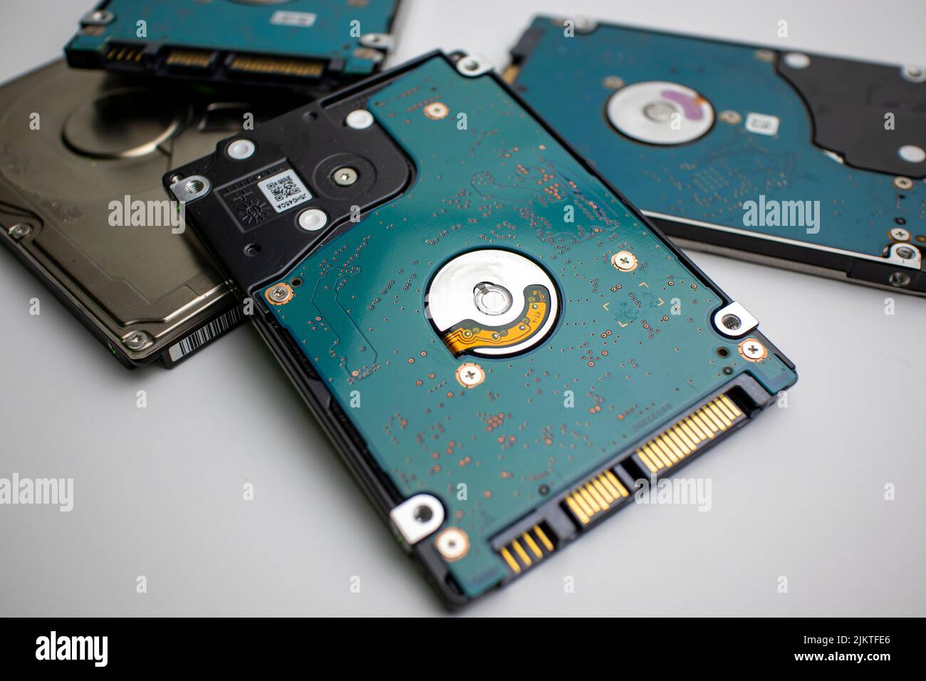 Stack of internal laptop hard drives in a pile scattered Stock Photo ...
