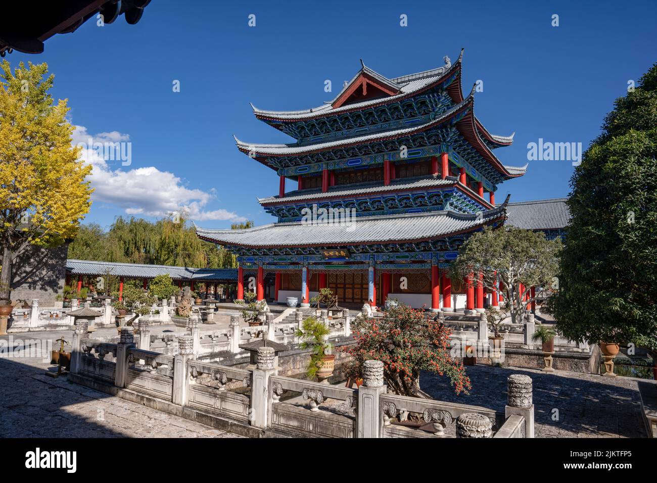 A side view of Mufu palace entrance surrounded by plants in Lijian ...