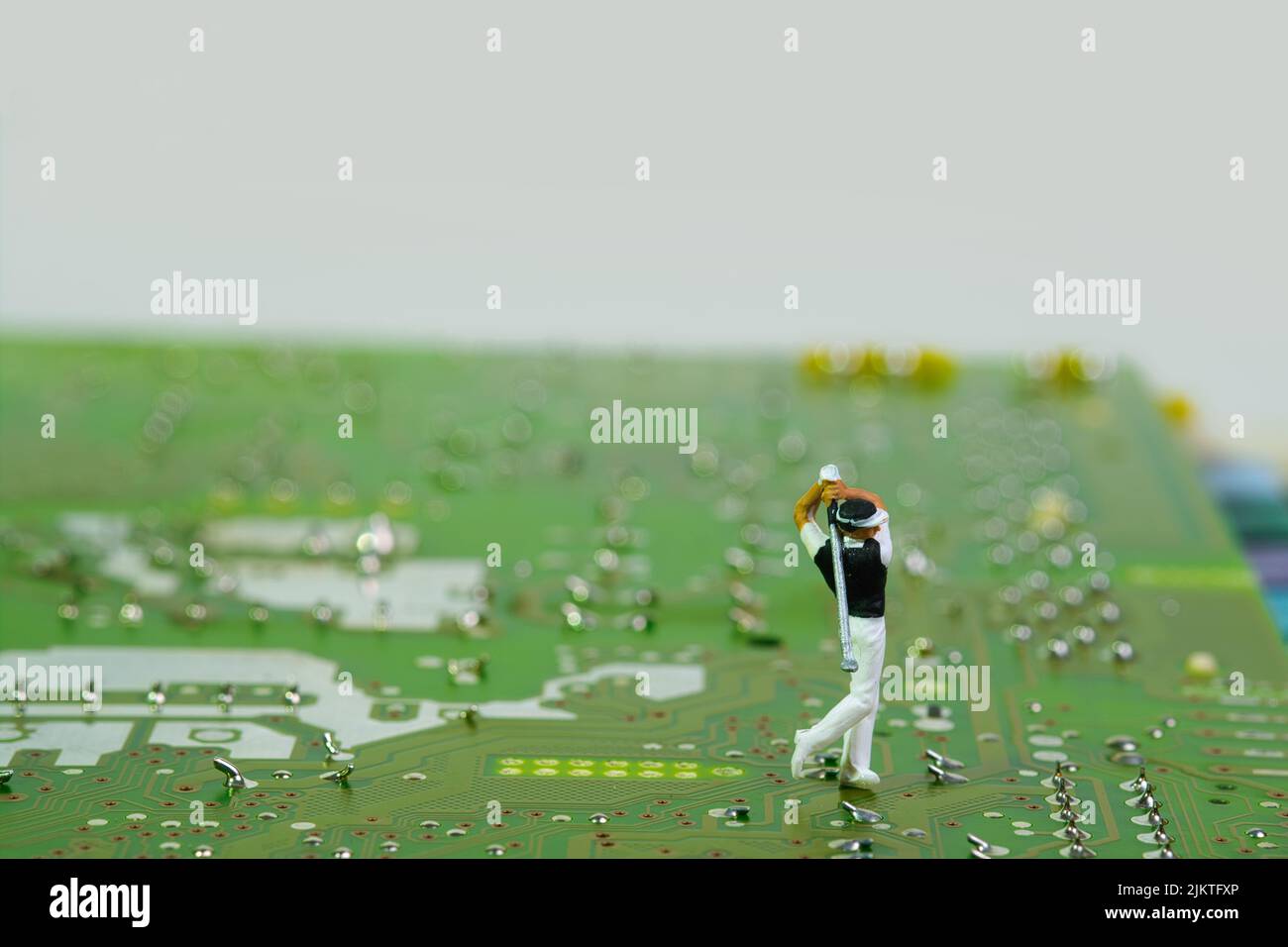 a golfer teeing off on an electronic circuit board, typical golfer ...