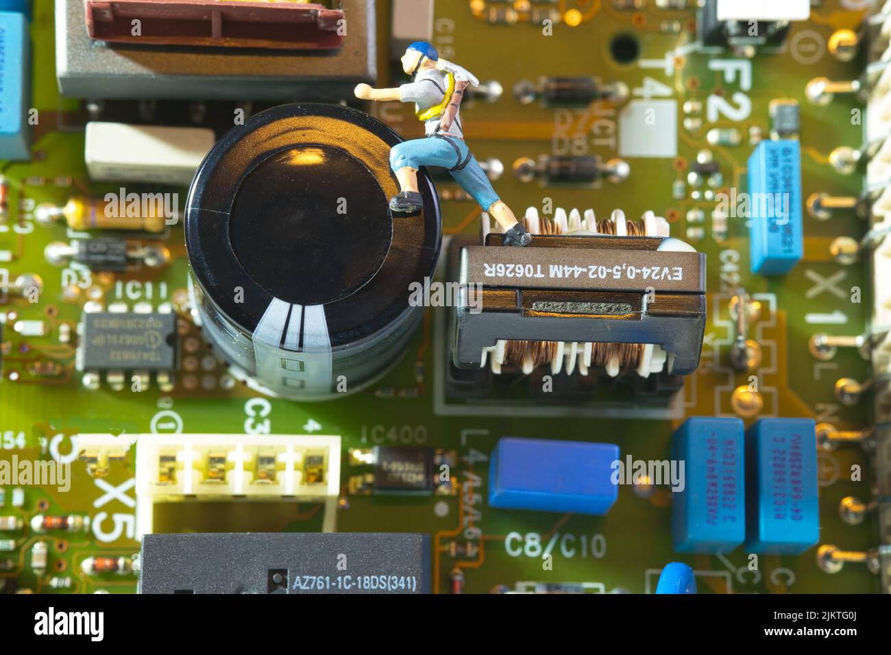 a climber with equipment climbs an electronic circuit board Stock Photo ...
