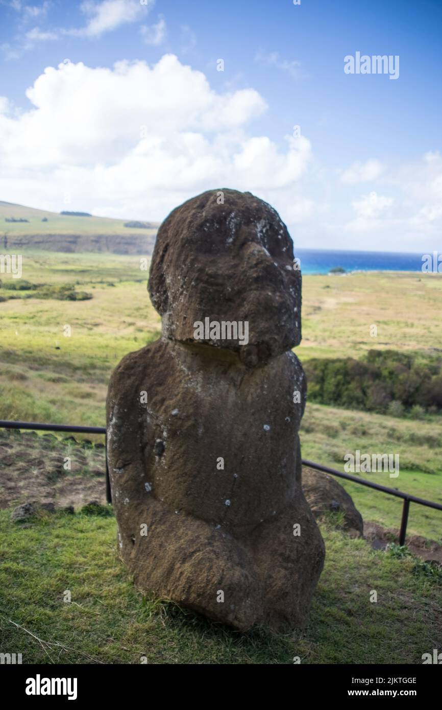 A vertical closeup of an antique Moai stone statue on Easter Island ...
