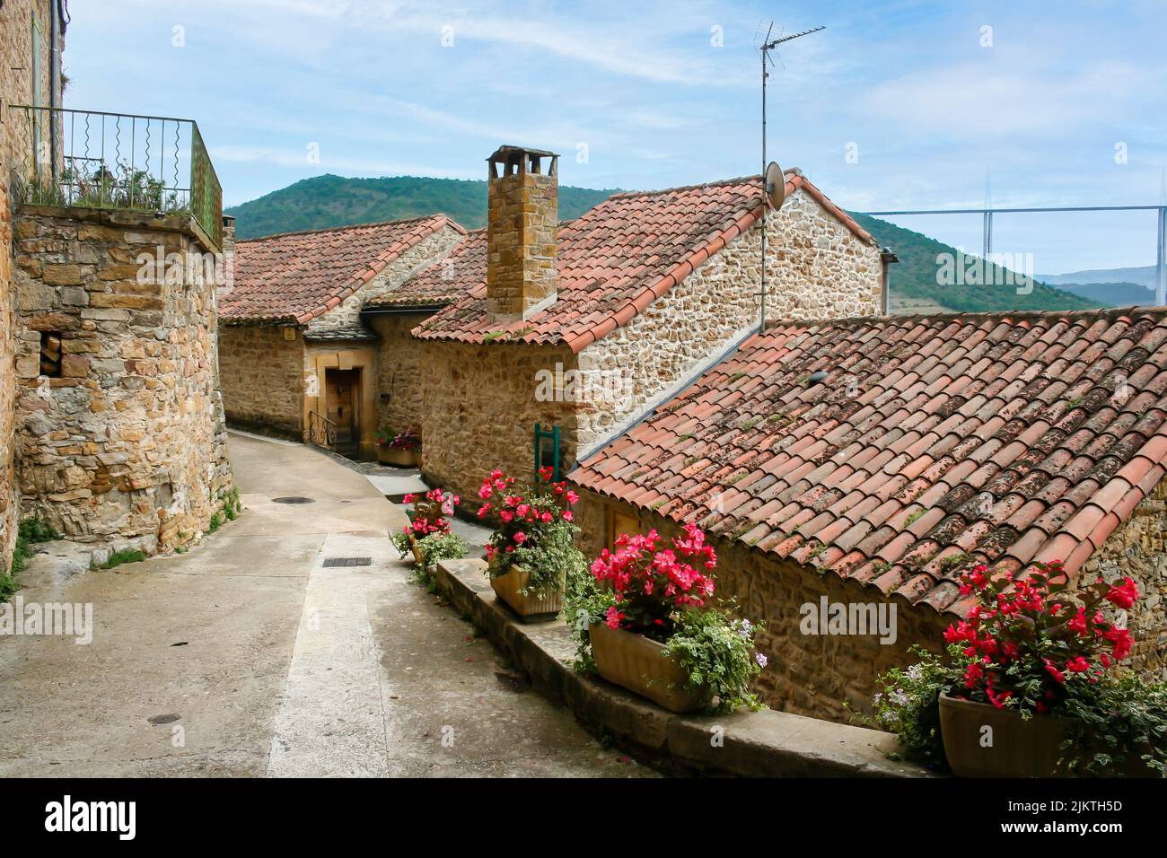 A path between medieval houses in rural aea Stock Photo - Alamy