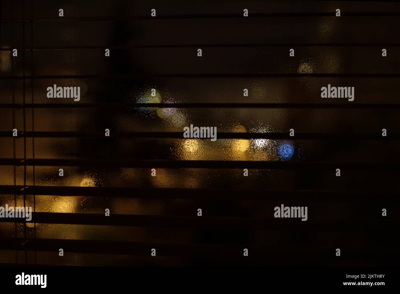 A beautiful night view through window blinds Stock Photo - Alamy
