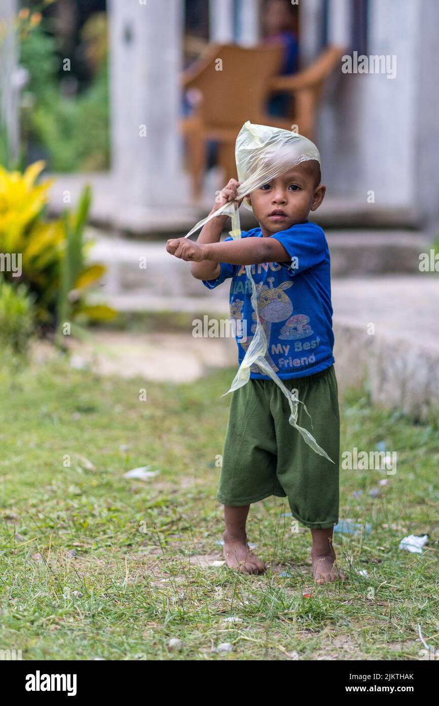 A closeup of a kid playing with a plastic bag Stock Photo - Alamy