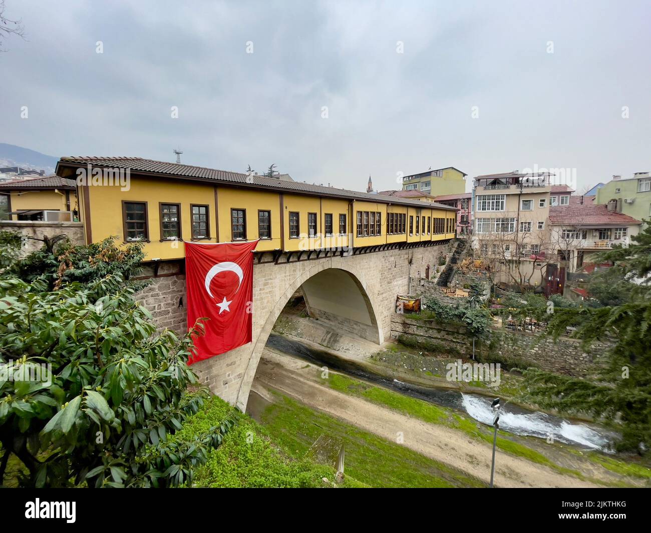 A Turkish flag hanging on the side of the historical Irgandi Bridge in ...