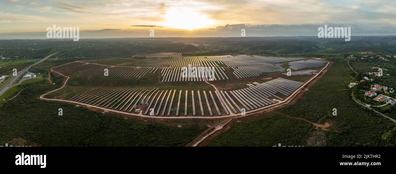 A panoramic aerial view of Lagos, Portugal with a bright golden sun ...