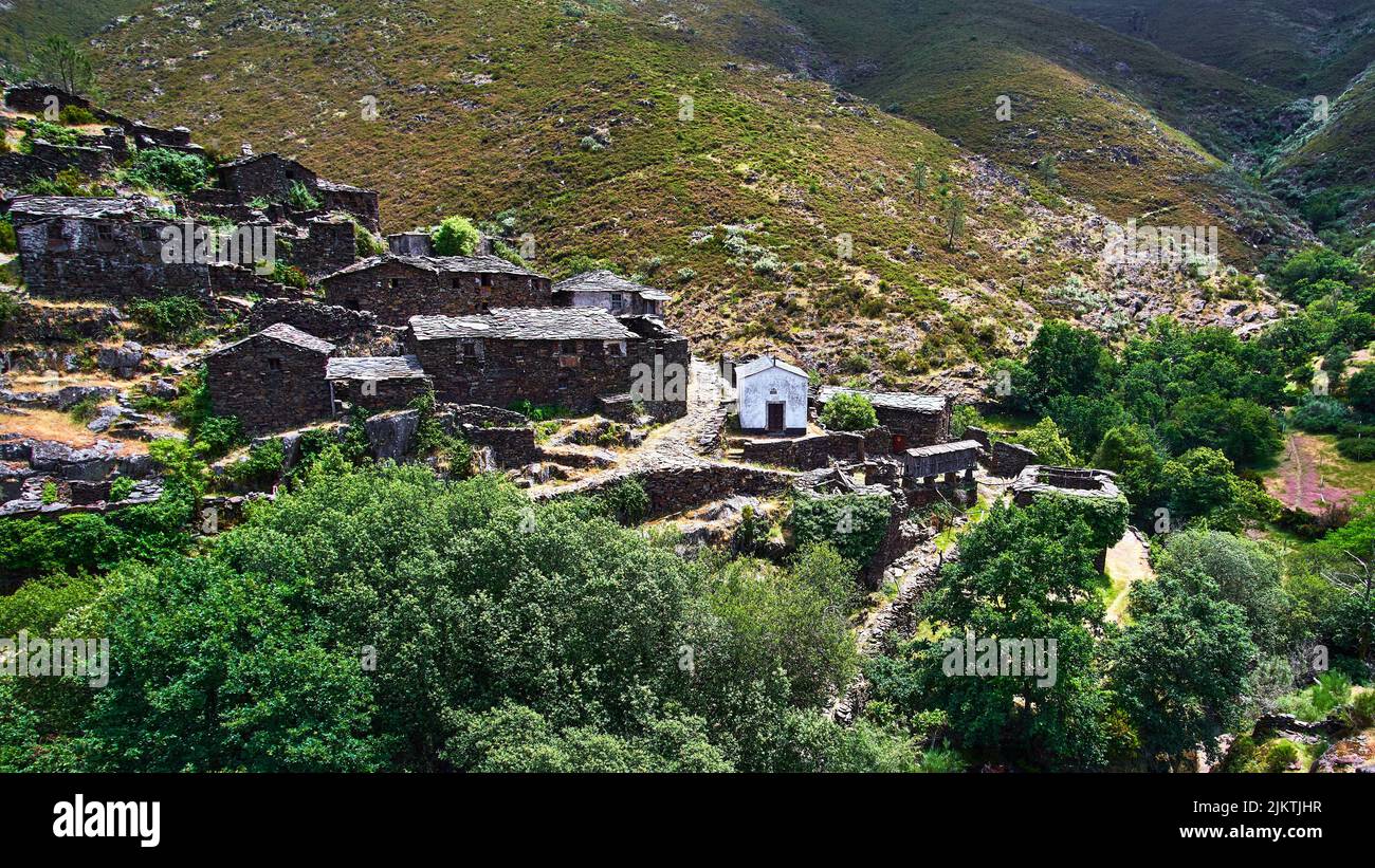 An old village landscape surrounded by mountains and countryside ...