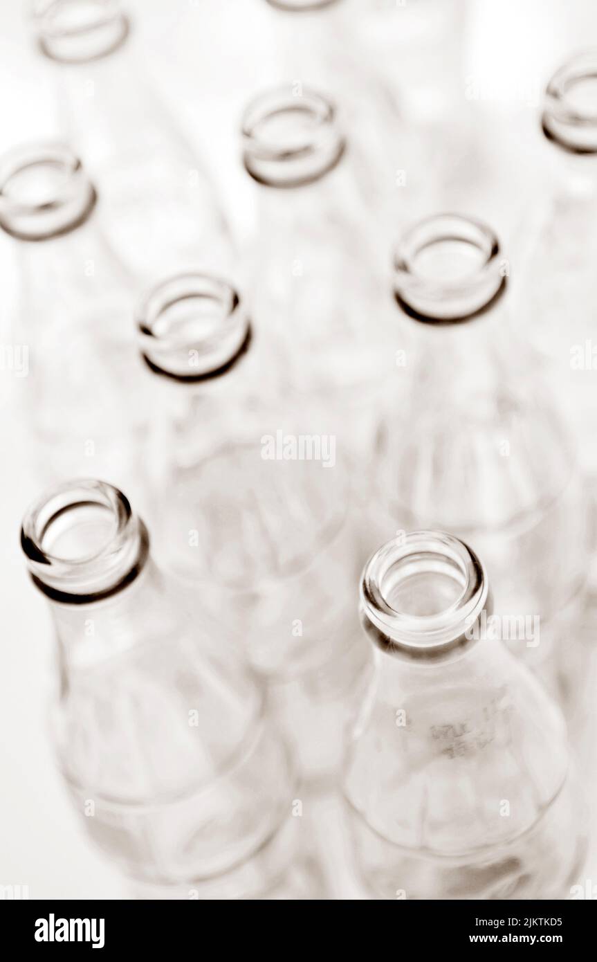 Open transparent empty glass bottles Stock Photo - Alamy