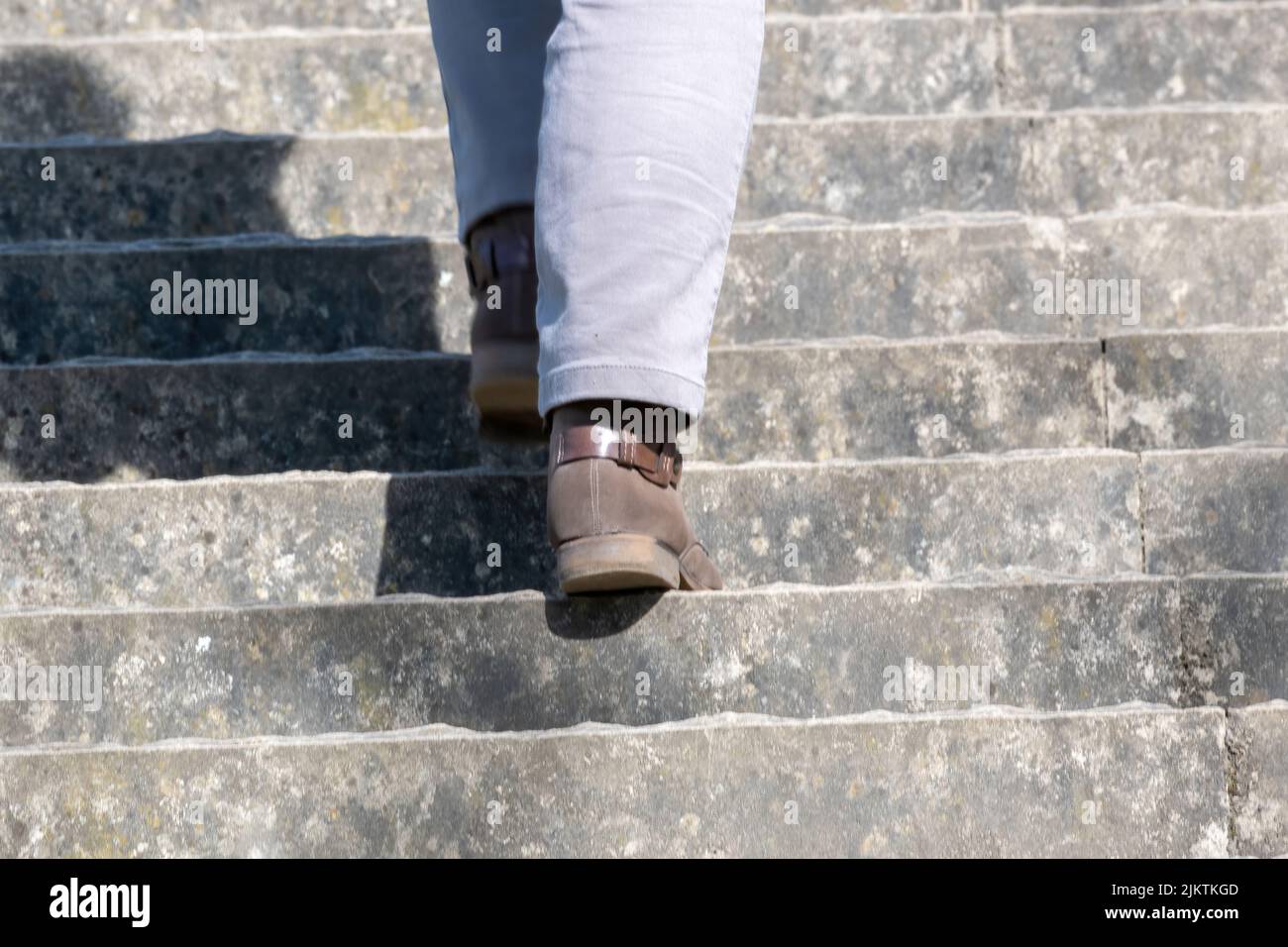 some shoes are walking in the sun Stock Photo - Alamy