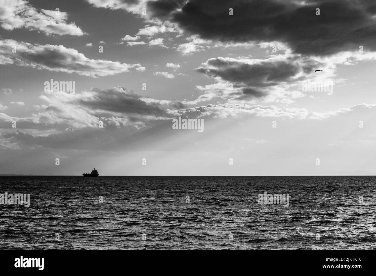 A grayscale scenic view of the evening clouds in the Patras bay Stock ...