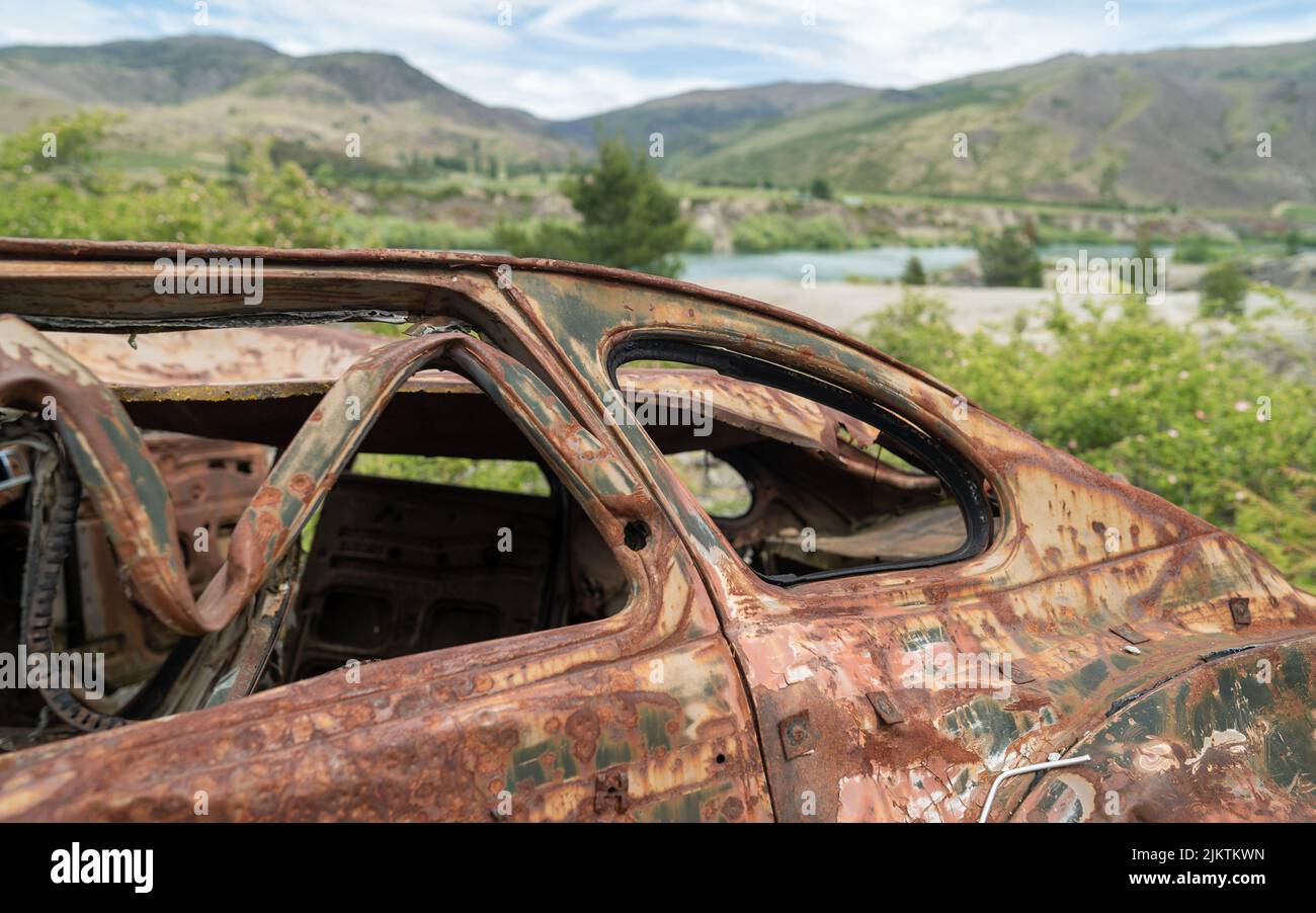 An abandoned broken car in the Bannockburn Bridge, heritage trail Stock ...
