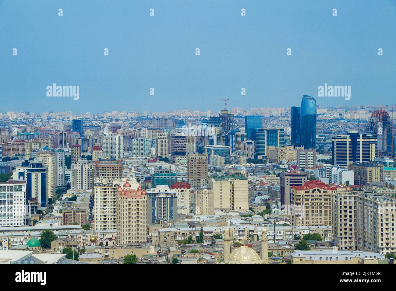 An aerial drone view of a city with mid-rise and high-rise buildings ...
