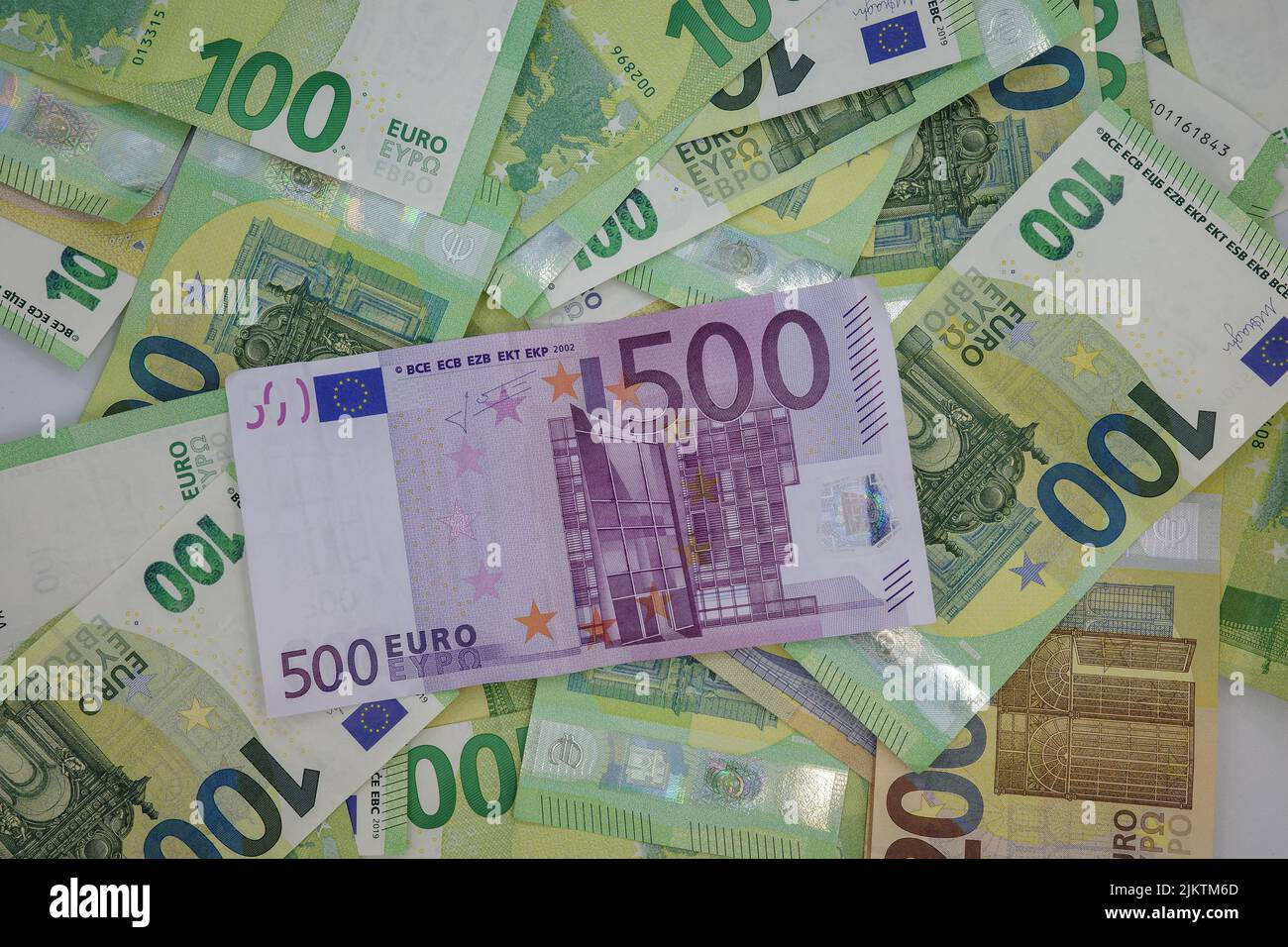 A closeup of 500 Euro banknote on top of a pile of 100 and 200 Euro ...