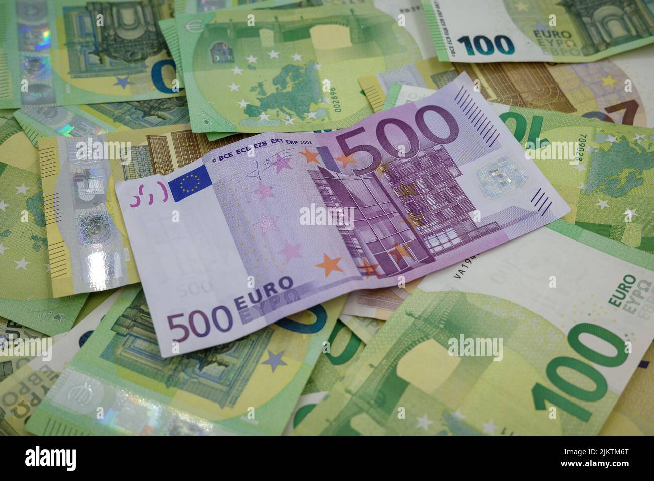 A closeup of 500 Euro banknote on top of a pile of 100 and 200 Euro ...