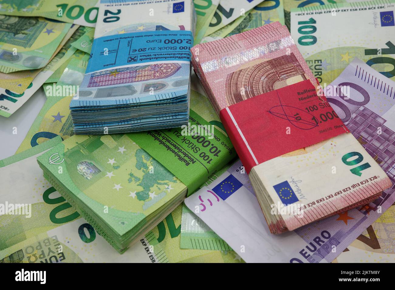 A closeup of stacks of Euro banknotes on top of each other from ...